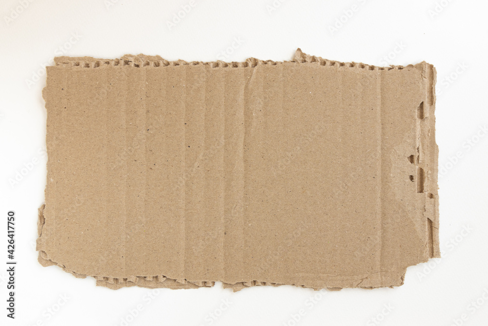 ripped piece of cardboard isolated on white background, cardboard scrap ...