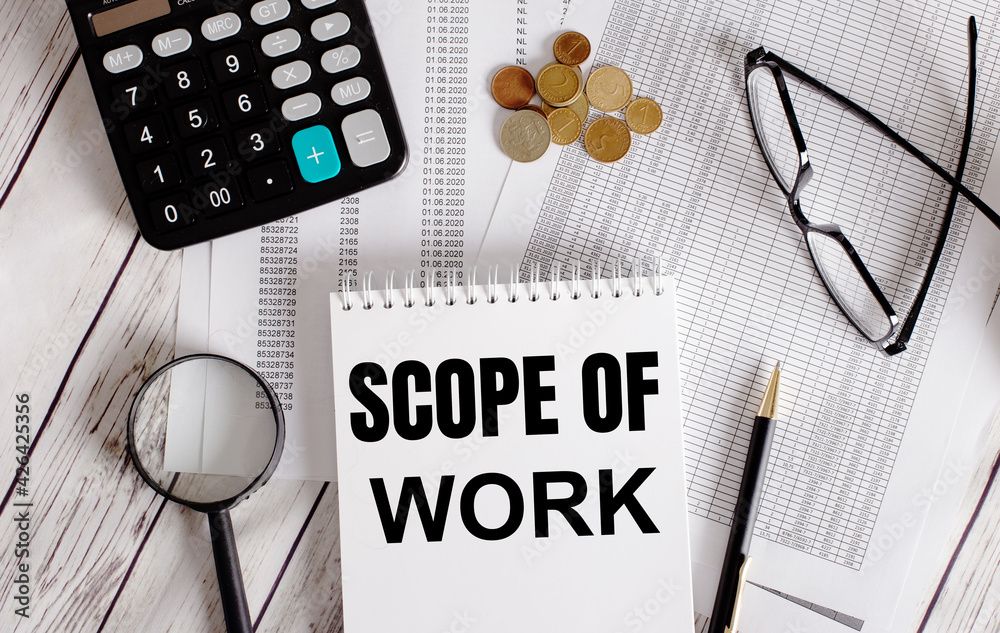 SCOPE OF WORK written in a white notepad near a calculator, cash ...