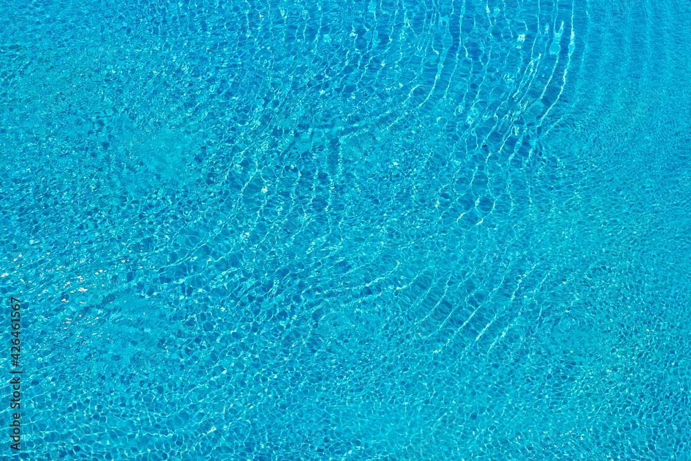 Blue water in swimming pool. Ripple wave in pool for background and ...