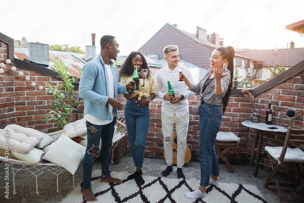 Full length portrait of multiracial friends standing together on open ...
