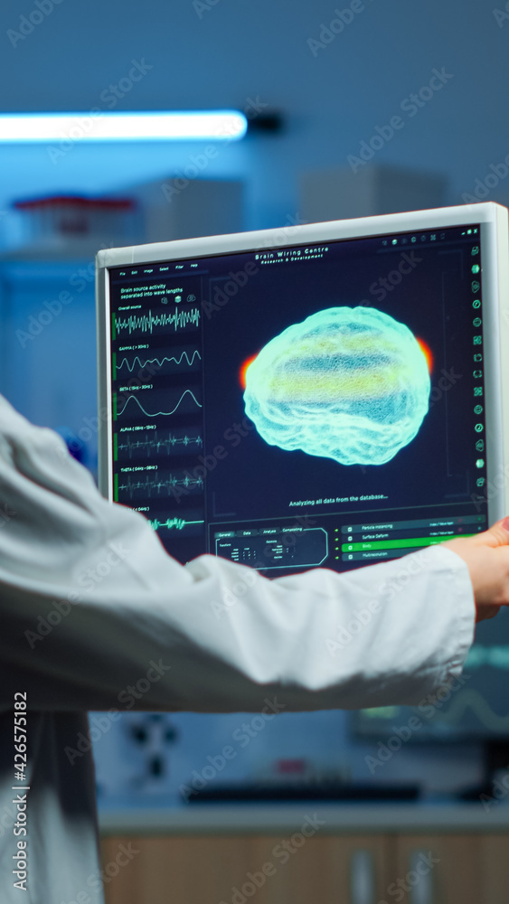 Foto de Neurologist doctor reading informations of patient looking at ...