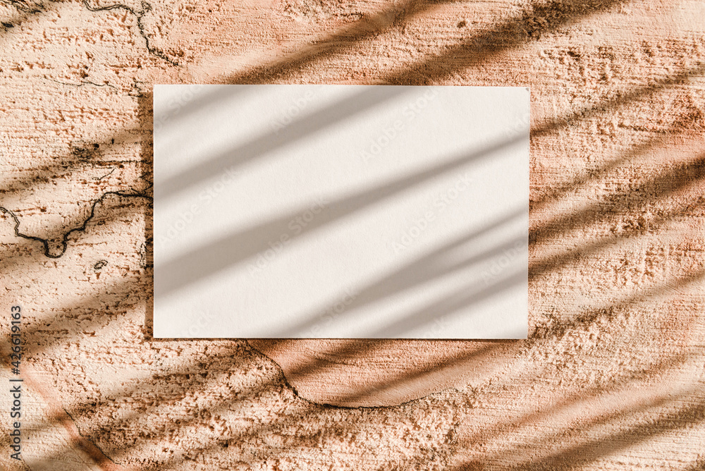 Blank card on wooden background with palm leaves shadows. Minimal ...