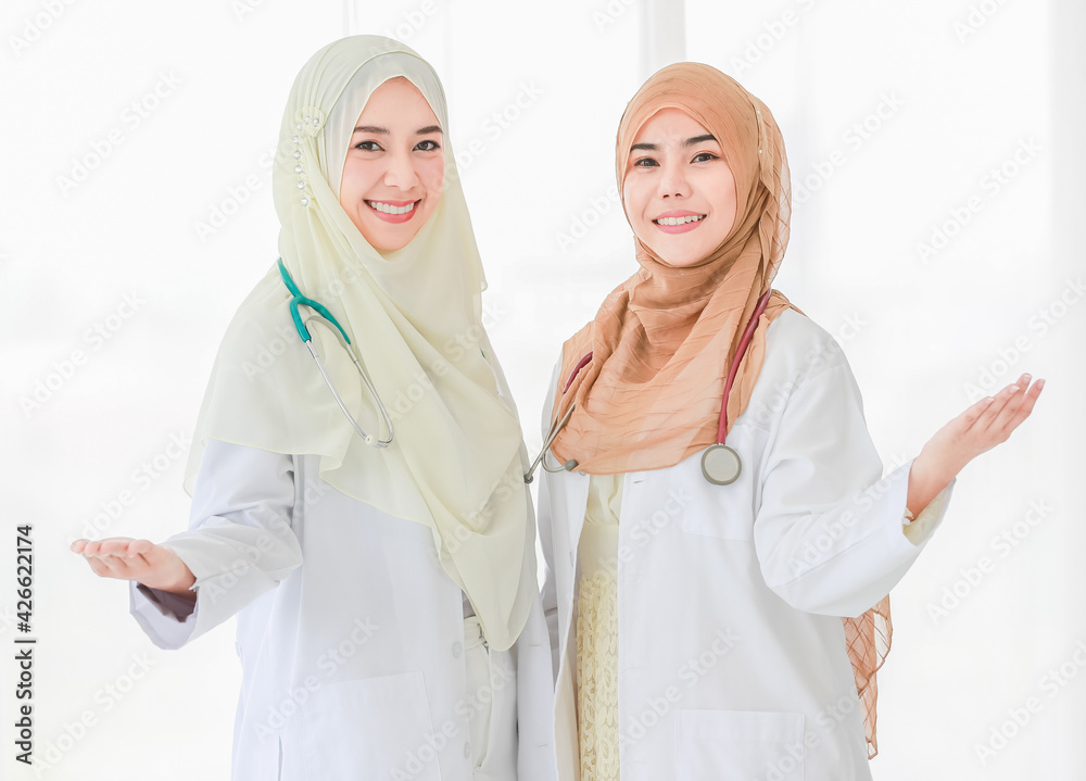 Portrait shot of two confident young adult Muslim doctors with a ...