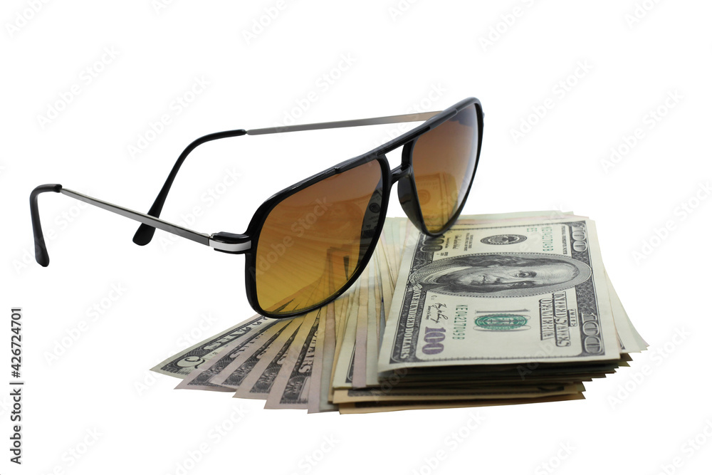 Sunglasses and paper american dollars isolated on white background as a ...