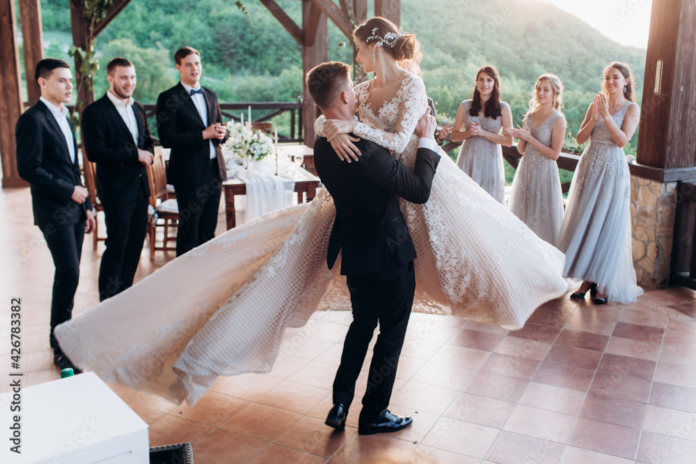 The first dance of the young. The bride and groom are dancing their ...