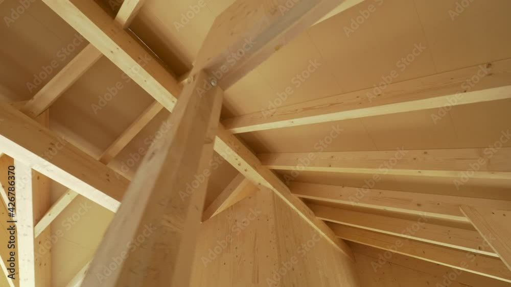 Beautiful view of the massive ceiling beams of a modern cross laminated ...
