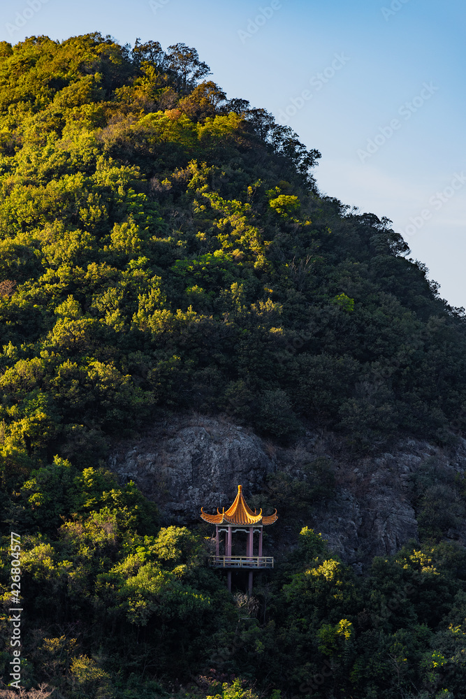 Antique hexagonal pavilion and trees on the mountain. Landscape of ...