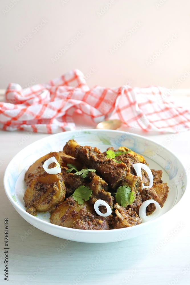 Mutton ghee roast. Goat meat fry with potatoes, also known as Mutton ...