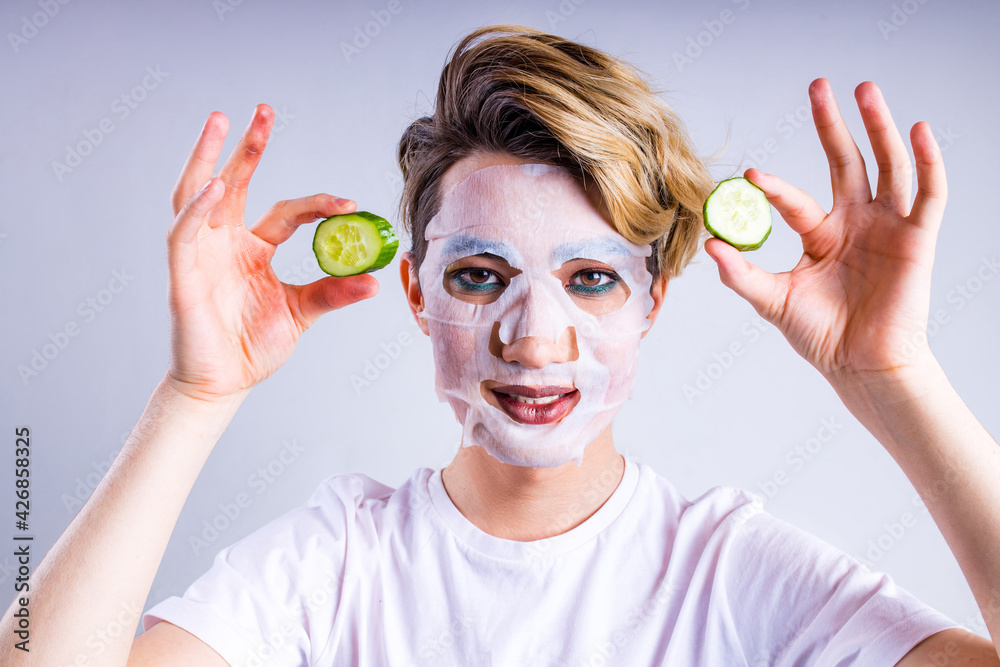 non binary portrait of asian man with luxurious blonde hair and ...