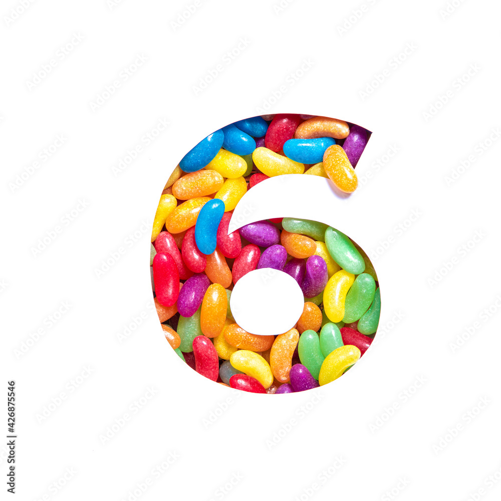 Number six of colourful candies jelly beans and paper cut in shape of ...