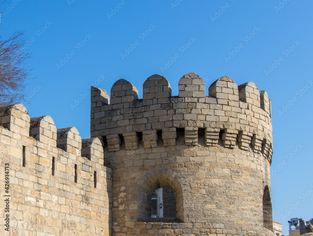 Medieval watchtower. Ancient castle palace in Baku. Castle wall and ...