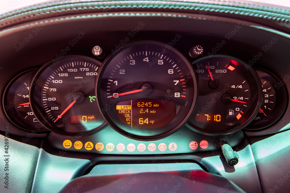 Sports car cockpit shows gauges with all warning lights illuminated on ...