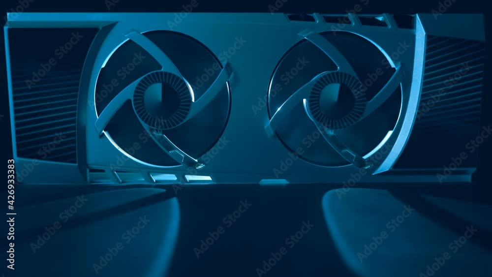 Against a black background, two cooling fans of a computer video card ...