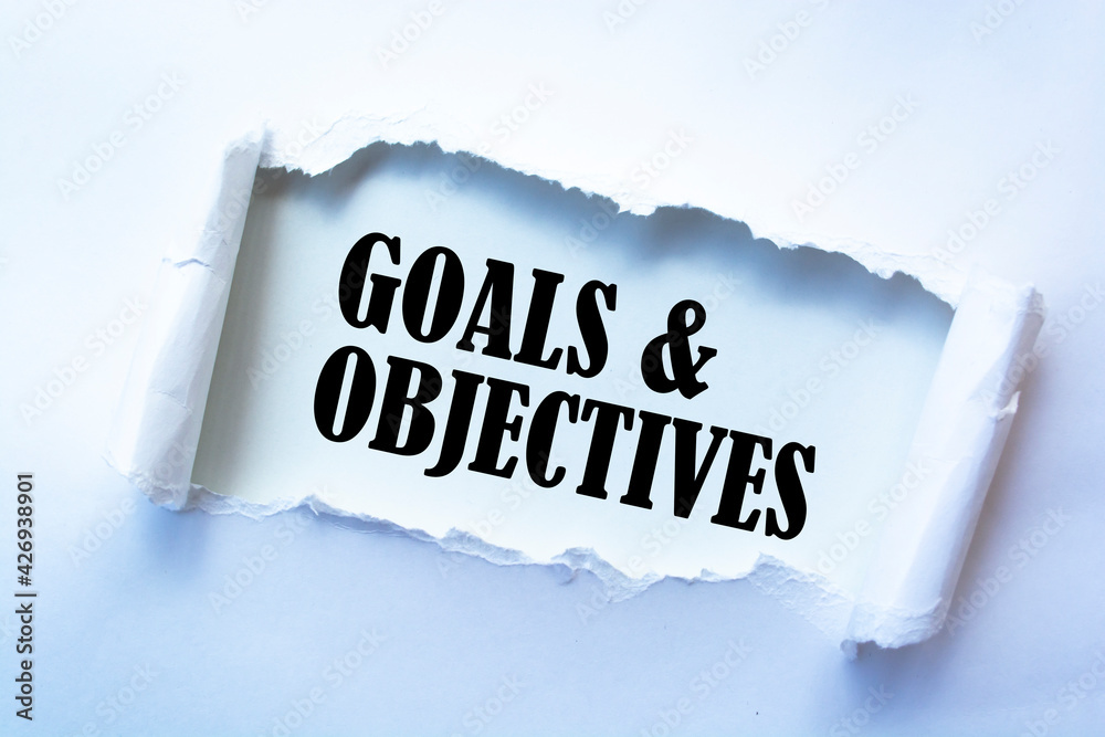 Goals and Objectives words written under torn paper. Stock Photo ...