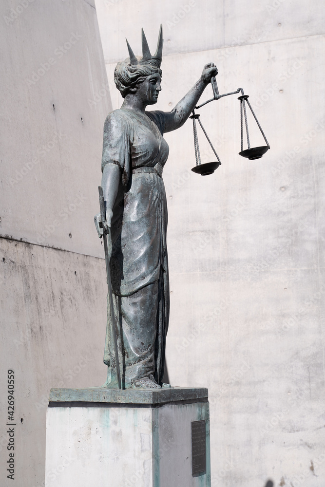 Statue of Lady Justice with the sword in one hand and the scales of ...