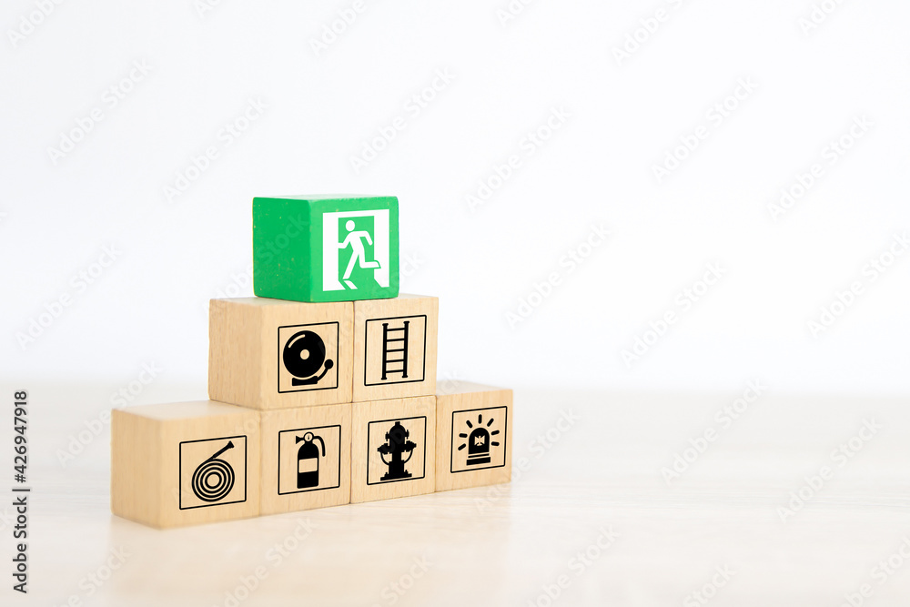 Fire, Close-up hand choose wooden toy blocks stacked in pyramid with ...