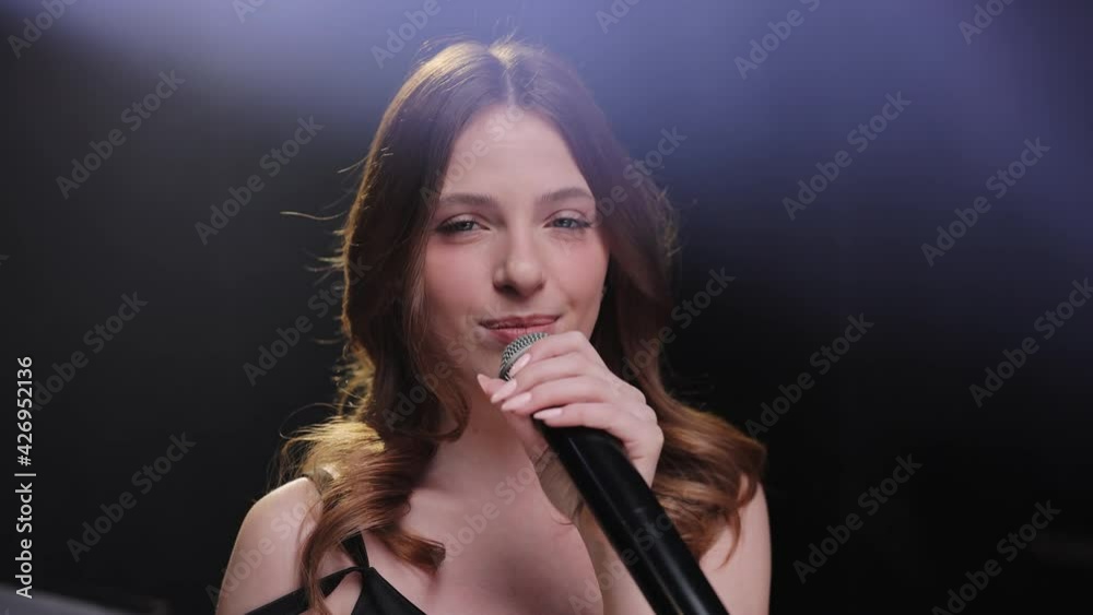Singing woman with microphone. Karaoke bar. Glamour professional singer ...