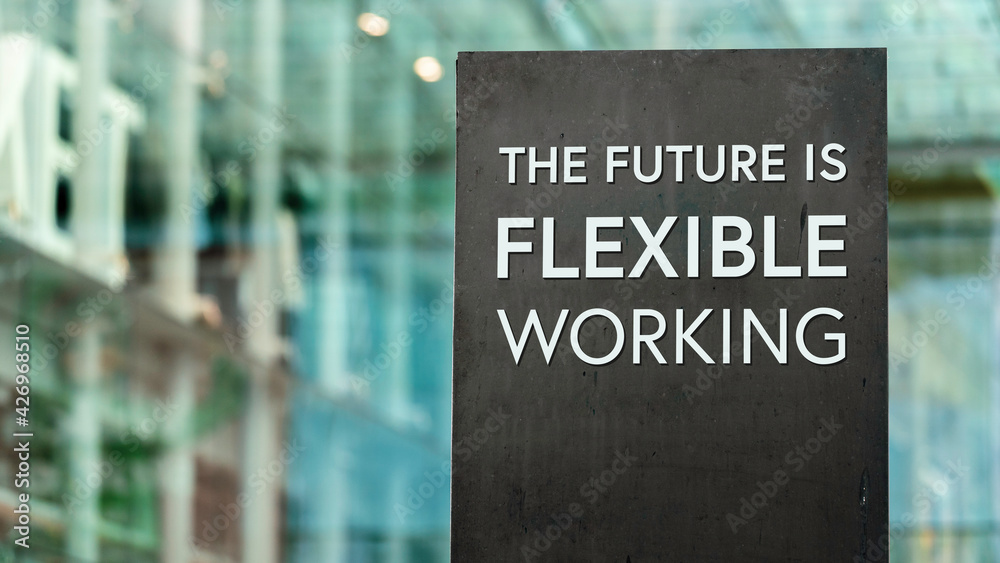 The future of work is Flexible sign in front of a modern office ...