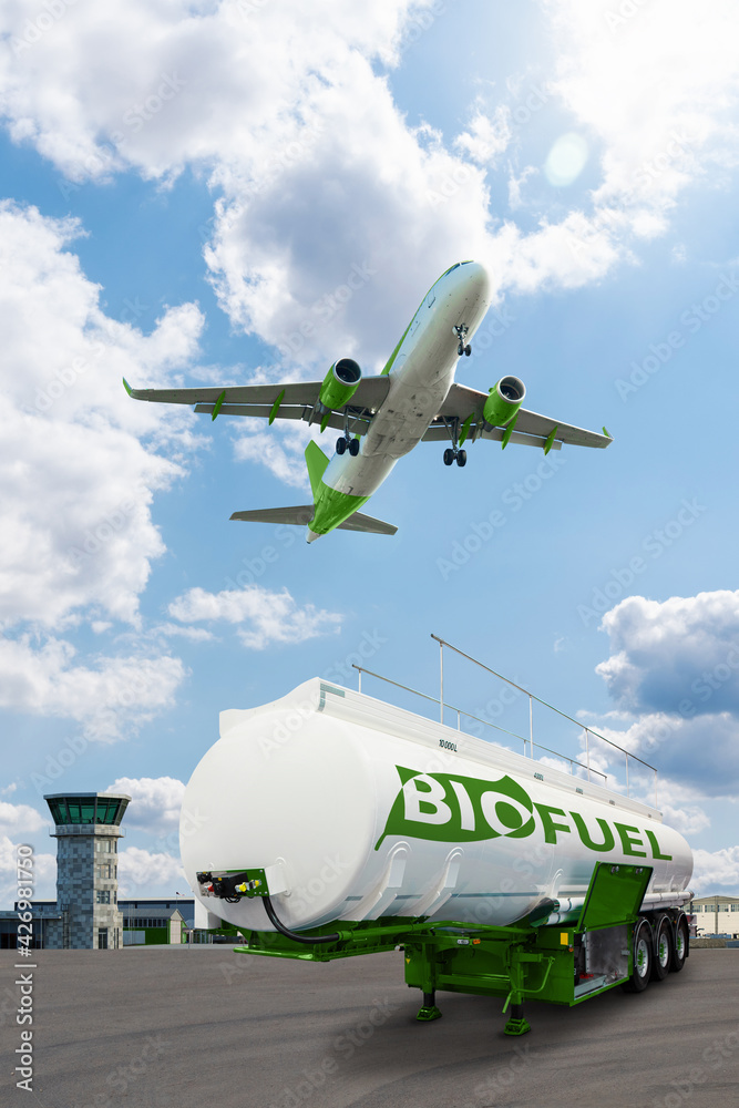 Airplane and biofuel tank trailer on the background of airport. Carbon ...