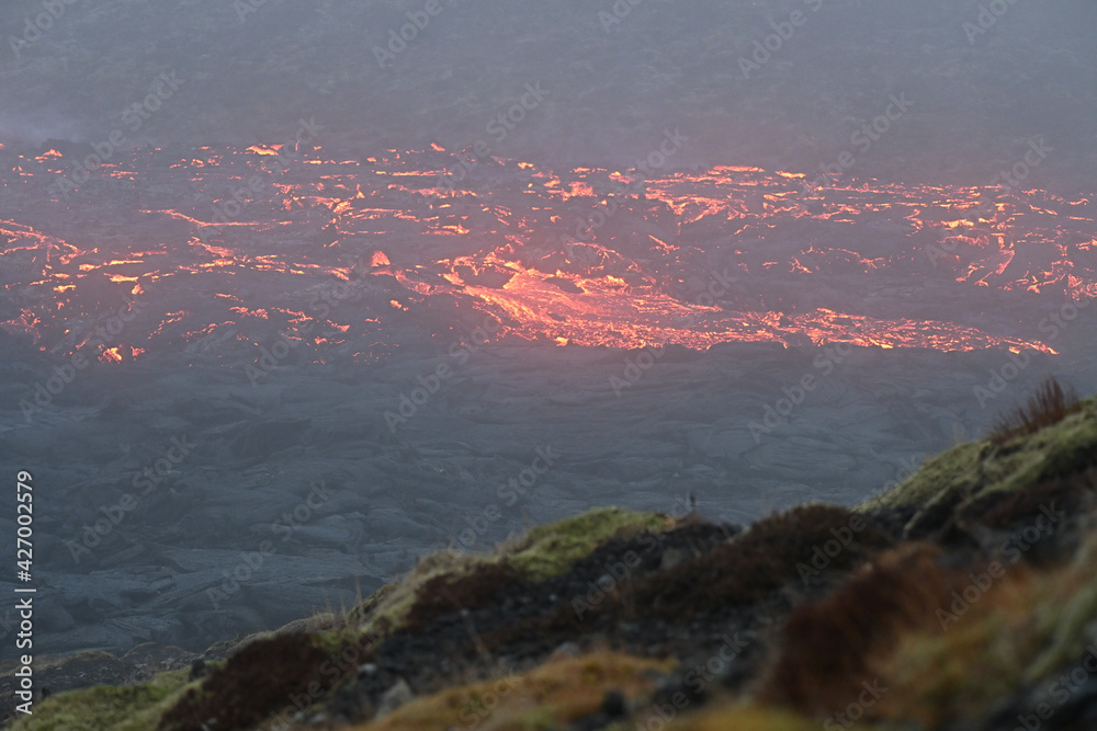 Lava flows from the volcanic eruption in a valley called Geldingardalir ...
