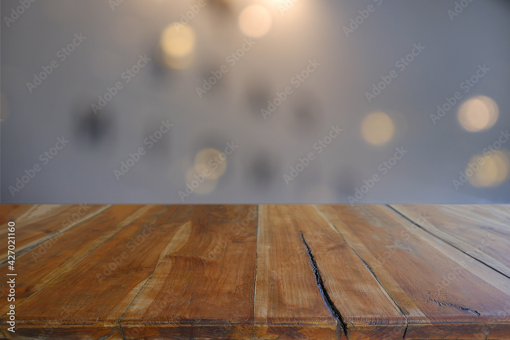 Empty wooden table in front of abstract blurred Cafe, restaurant at ...