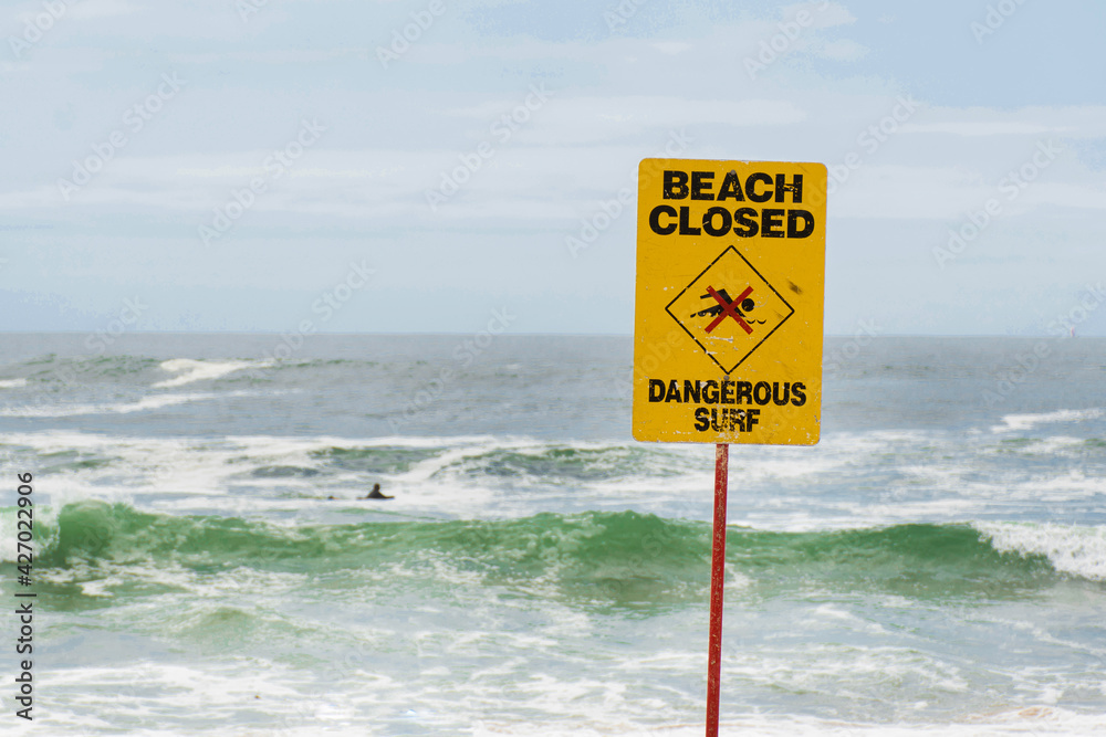 Beach closed sign for swimmers at the beach in Australia. Dangerous ...