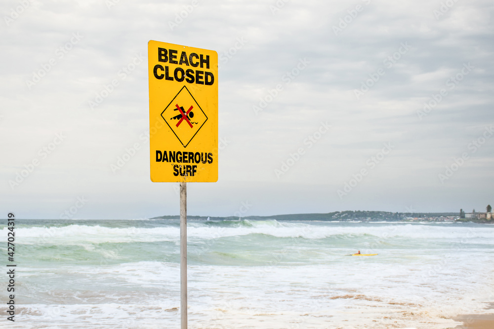 Beach closed sign for swimmers at the beach in Australia. Dangerous ...
