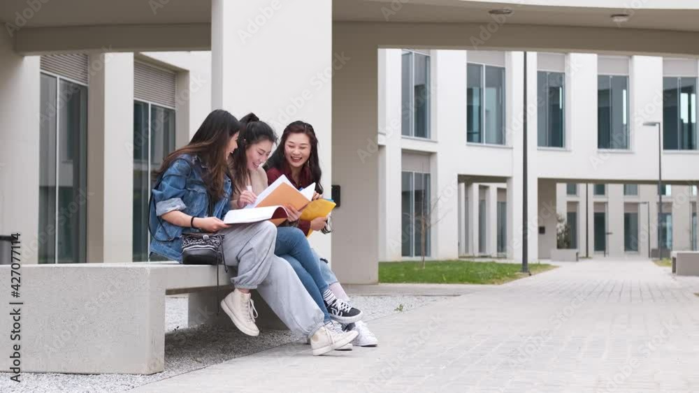 three asian girl students talking at break time sitting on campus Stock ...