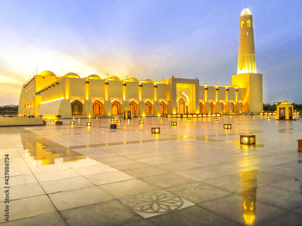 Scenic Doha Grand Mosque with minaret illuminated, mirrors on the ...