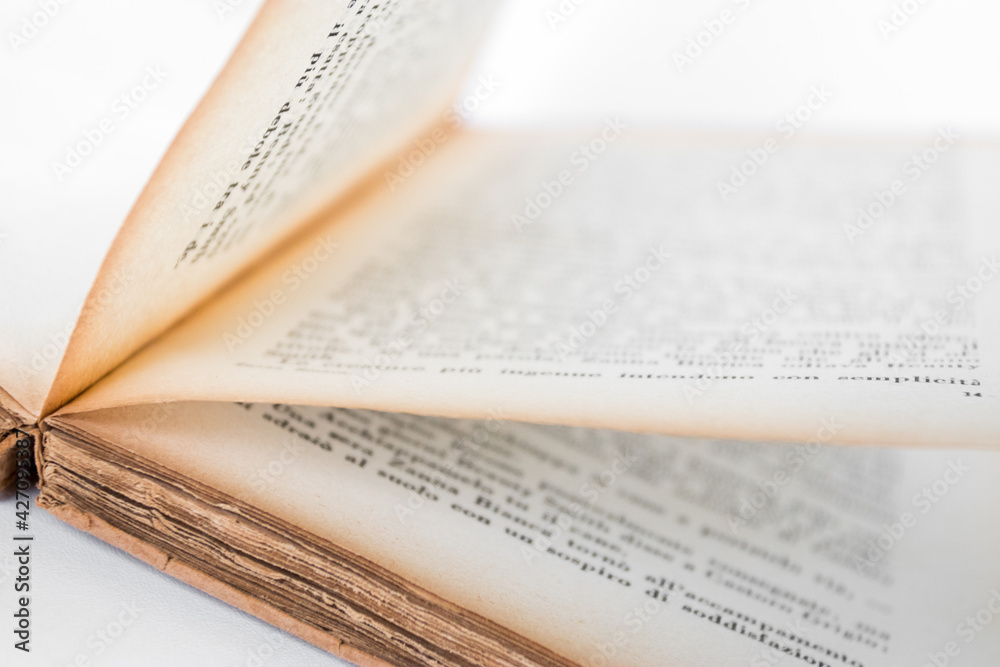 Antique open book isolated with flipping pages on white background ...