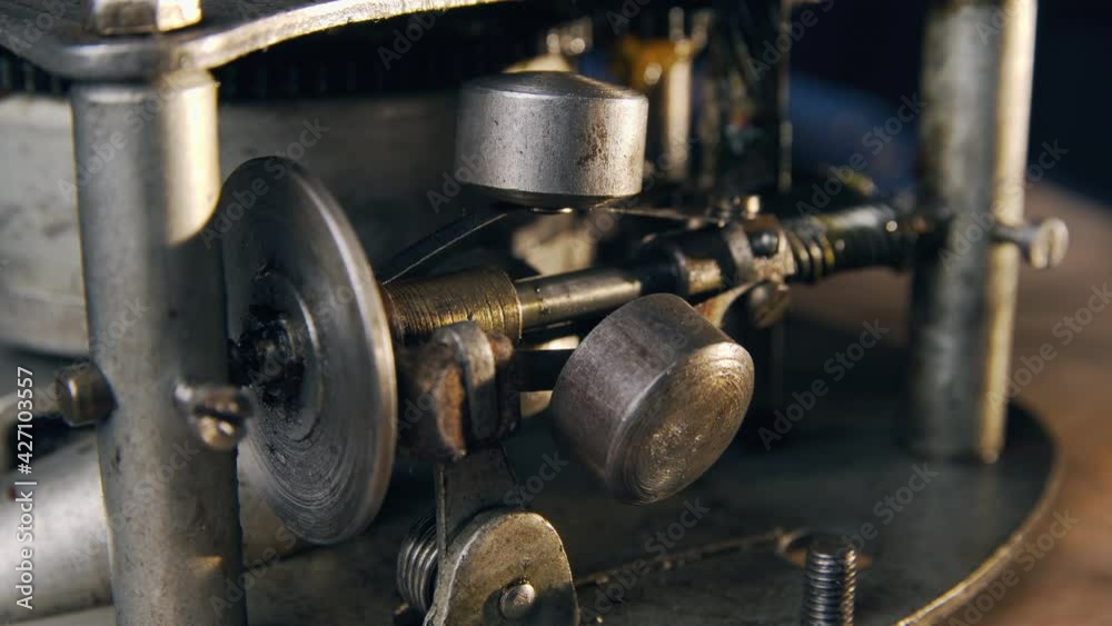 Engine parts. Metal mechanism with weights that rotate around the axis ...