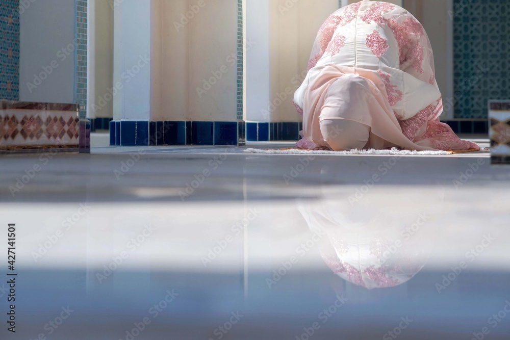 Muslim women gesture pray at public Mosque (Islamic temple),bow down ...