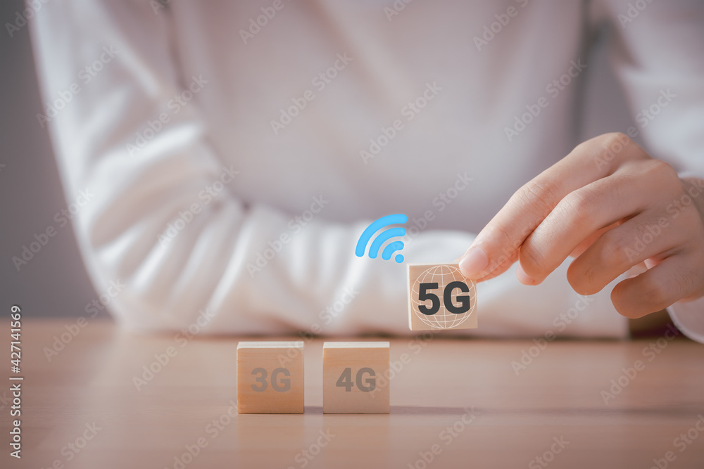 Woman hand chooses wood block 5G, Symbol of the change from 3G,4G to 5G ...