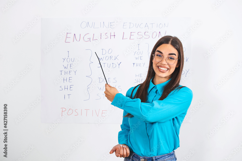 Modern education remotely. Cheerful young woman points to blackboard ...