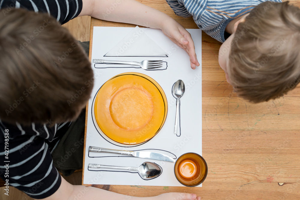 Kid learning to Serve a Table. Task according to Montessori methodology ...