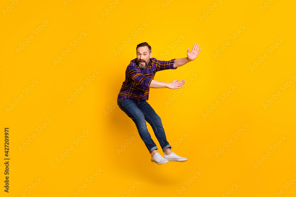 Full length body size photo of man jumping flying back while windy ...