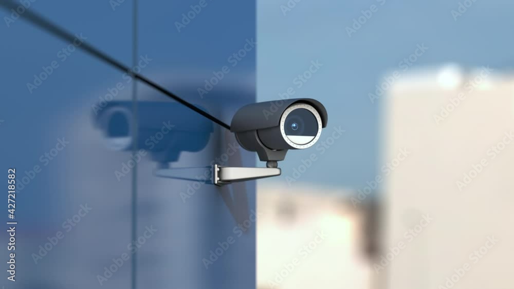 Security video camera scanning city street area for surveillance ...