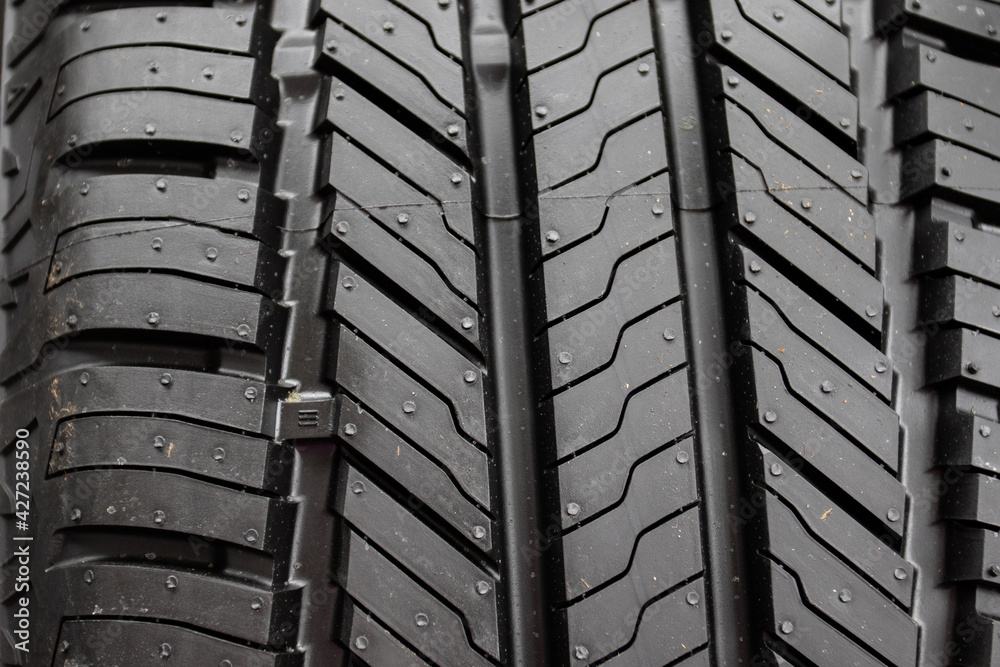 Symmetrical directional tire tread pattern for car. Tire surface ...