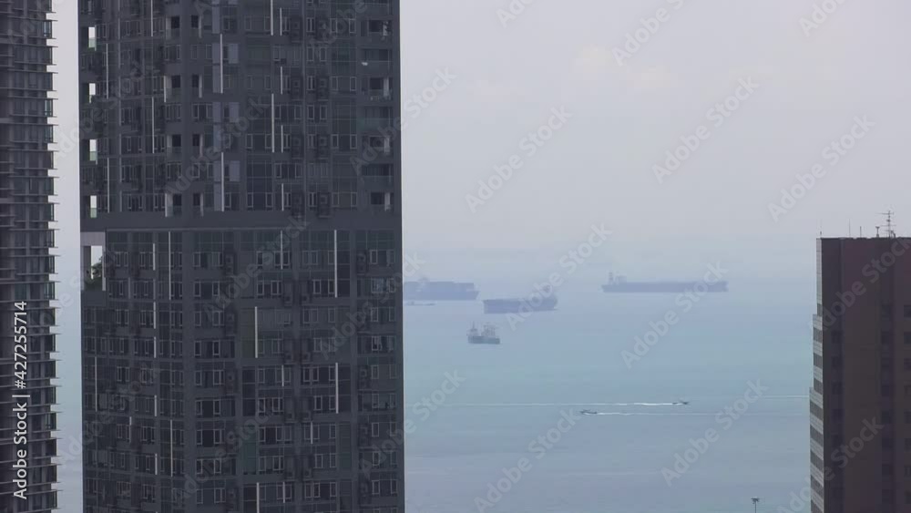 Skyscrapers in front of Singapore River with Cargo Ships in the ...
