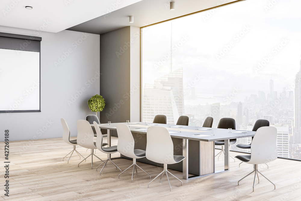 SIde view on big conference table in modern meeting room on high floor ...