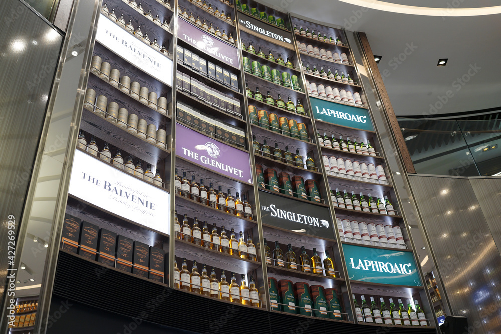 Interior view of various brands of whiskey display on store shelf in ...