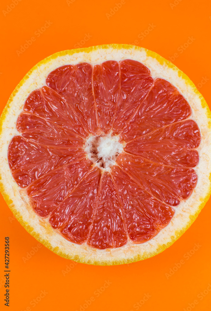 Grapefruit texture inside on the orange background. Citrus close up ...