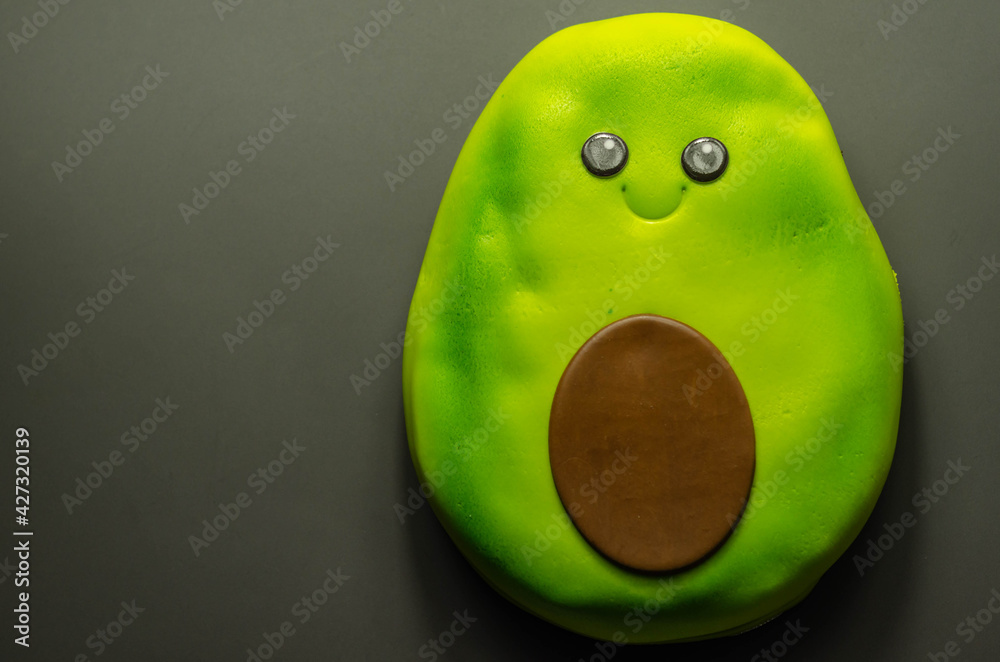 Vegan cake in a shape of avocado, chocolate sponge with a layer ...