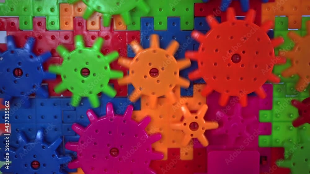 Plastic toy cogwheel Working for common goal, conceptual. Gears and ...