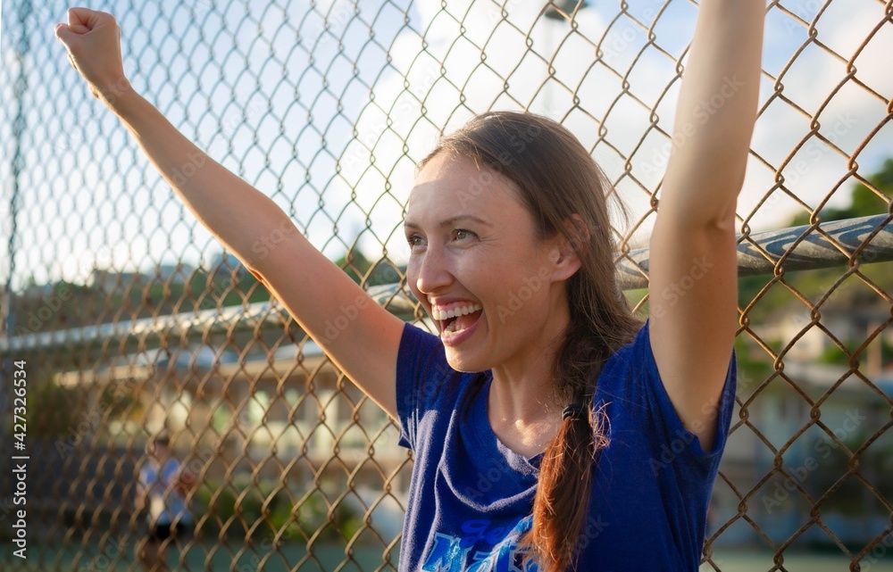Mother cheering and praising her child at a field game. Happy parents ...