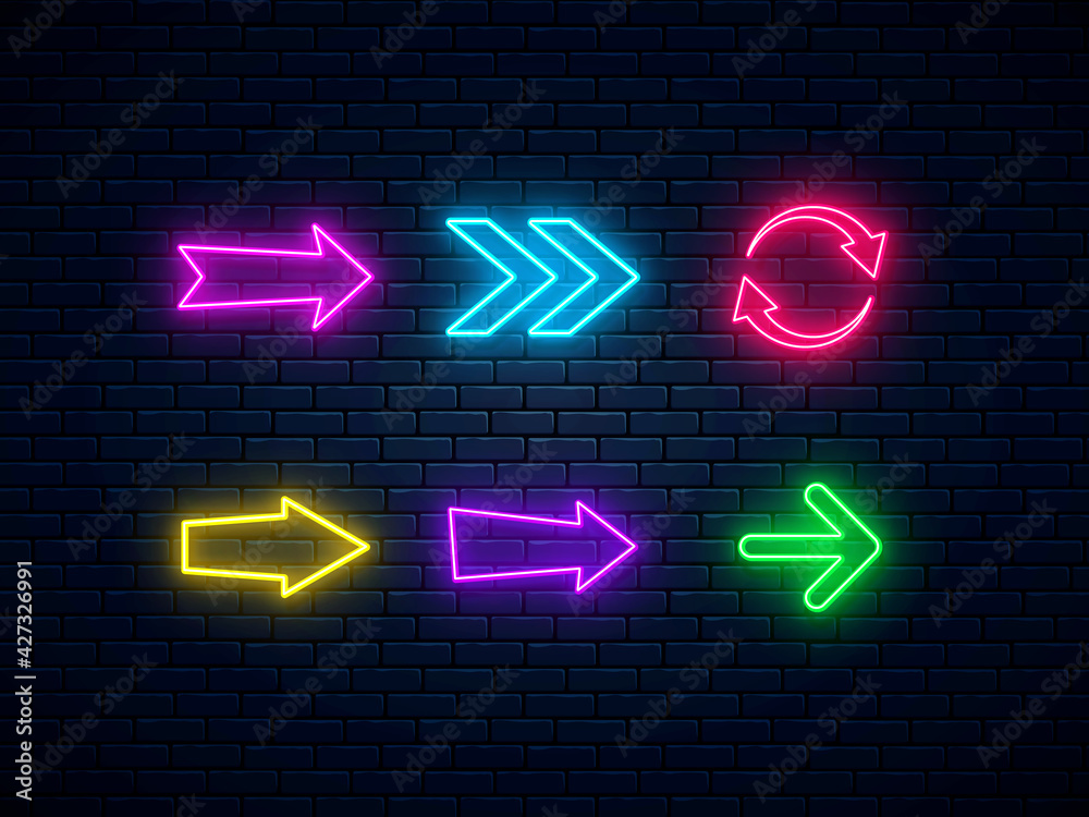 Neon arrow signs set. Bright arrow pointer symbols on brick wall ...