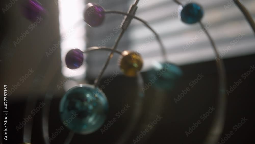 concentric rotating rings around a moving sphere. It looks like a ...