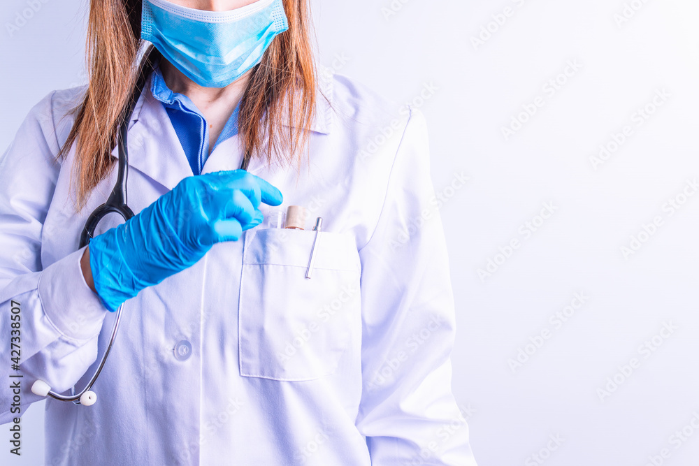 Selective view of doctor hand in gown and stethoscope and gloves ...