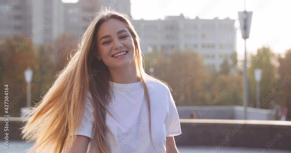 Portrait happy young female model student outdoors with surprised face ...