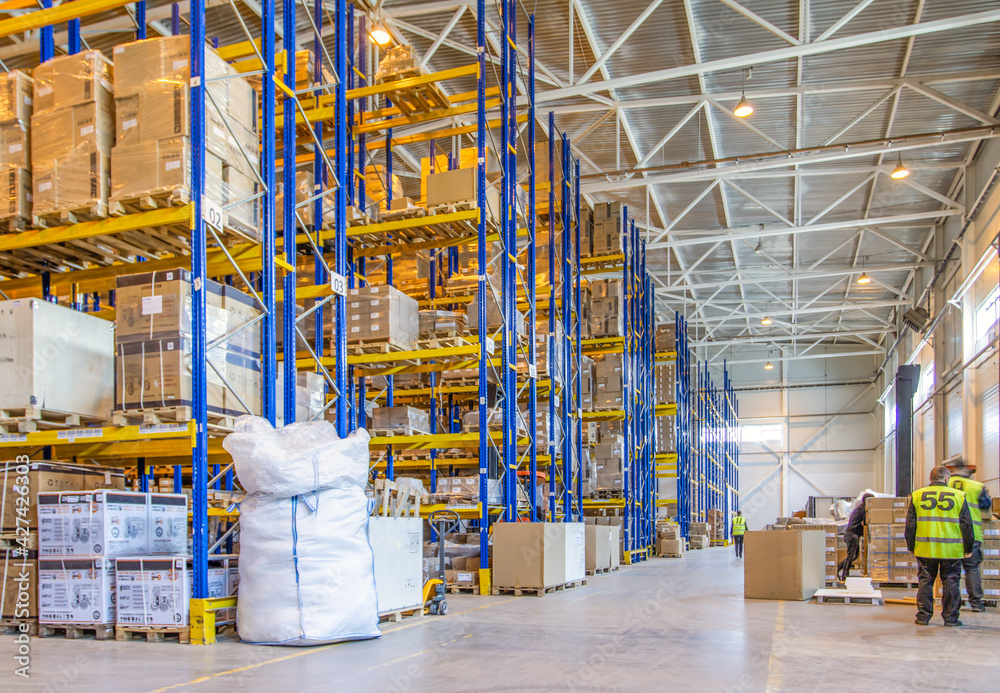 Interior of a modern warehouse storage with rows and goods boxes on ...